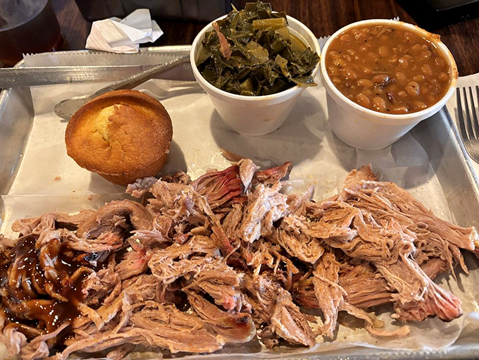 Tender pulled pork with classic Southern sides - proof that sometimes the simple things in life are the most satisfying. 