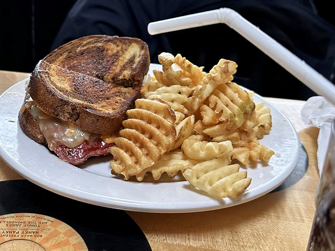 Meet the Reuben that ruined all other sandwiches. Those waffle fries? They're not just a side dish, they're a supporting act worthy of an Oscar.