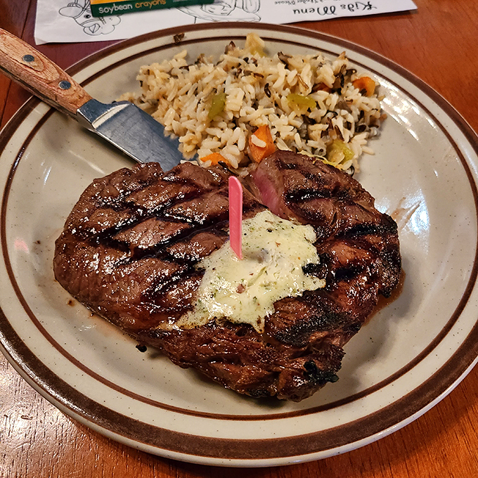 This ribeye's so juicy, you might need a rain slicker. Paired with a loaded spud, it's comfort food that hits the bullseye. Photo credit: C. Schmidt