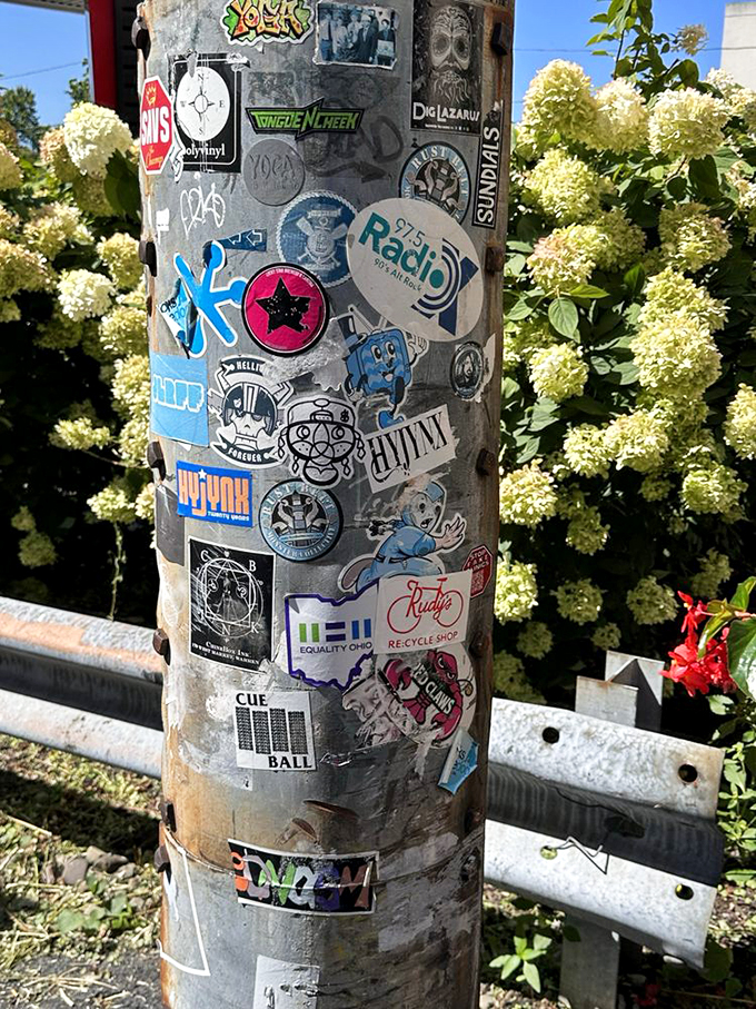 A pole of rock 'n' roll dreams! Each sticker tells a story, like a vertical vinyl collection of musical memories.