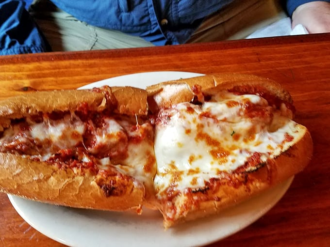 When a sandwich looks this good, you know you're in for something special. The melted cheese cascade is pure food poetry.