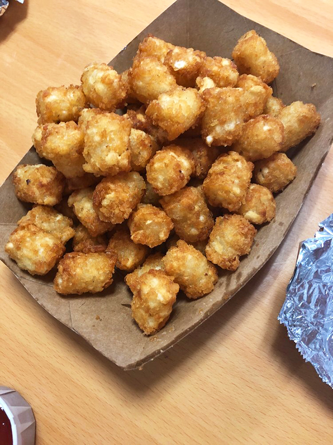 These aren't your cafeteria's tater tots - each golden nugget is perfectly crispy outside, cloud-soft inside, and utterly irresistible.