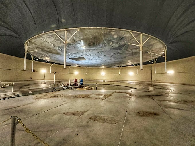 This massive chamber expands and contracts like a giant mechanical lung, helping regulate air pressure throughout the facility.