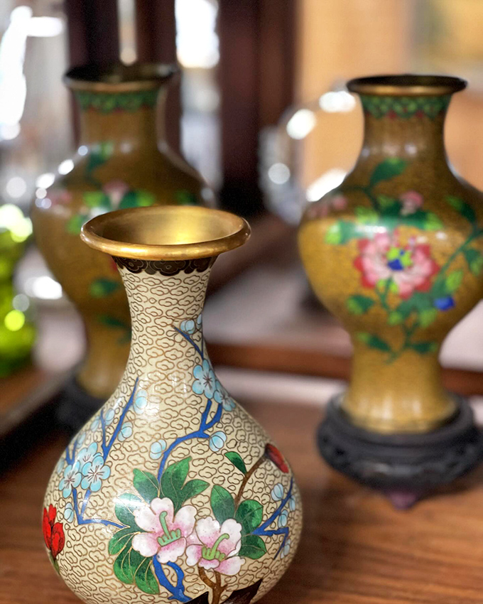 Delicate Asian-inspired vases showcase intricate craftsmanship that would make any collector's heart skip a beat.
