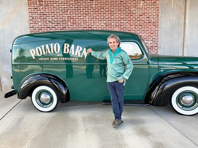 The Potato Barn's facade is a time-traveling delight. Those vintage rides aren't just cars, they're four-wheeled time machines ready to roll! Photo credit: Lynne Stanforth