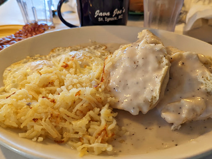 Comfort food that hugs your soul! These biscuits and gravy look like they could cure everything from a broken heart to a Michigan winter.