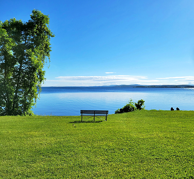 Postcard-perfect moment: A bench with the best seat in the house, overlooking Lake Champlain's mesmerizing blue expanse.