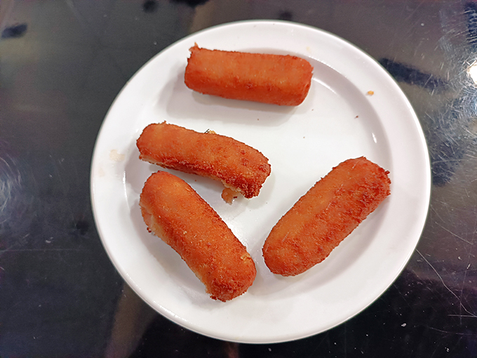 Croquetas: The ultimate handheld happiness. These crispy cylinders of joy are like edible stress balls, but way more delicious. Photo credit: Ernesto Roubert