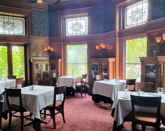 Sunlight streaming through stained glass turns this dining room into a kaleidoscope of culinary possibilities.