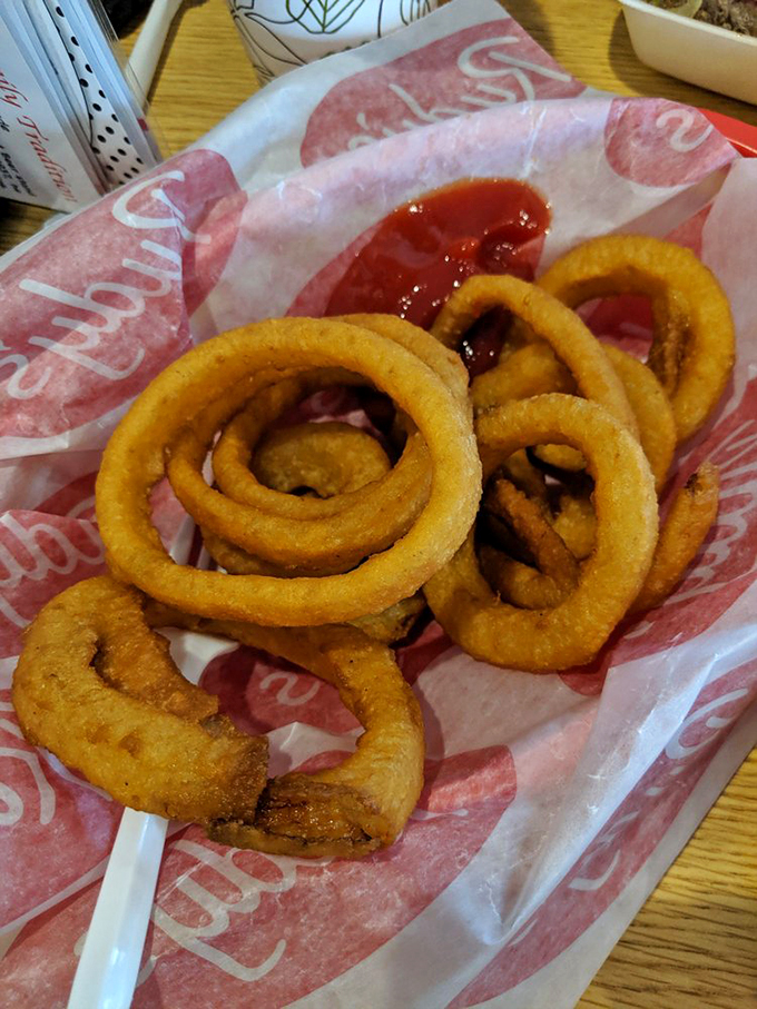 Crispy, golden rings of joy! These onion rings are the jewelry of the fast food world &ndash; deliciously accessorizing any meal.