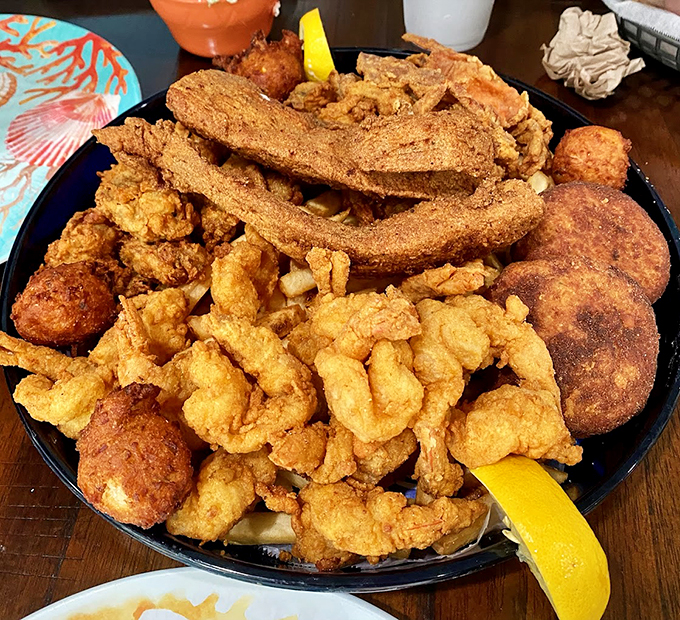 The seafood lover's dream come true. This golden-fried feast is what happens when the ocean meets the deep fryer.