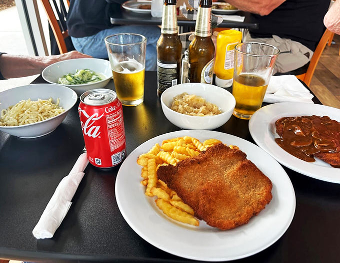 The ultimate dynamic duo: crispy schnitzel meets golden fries. It's like Batman and Robin, if they were delicious and came with a side of pure joy.