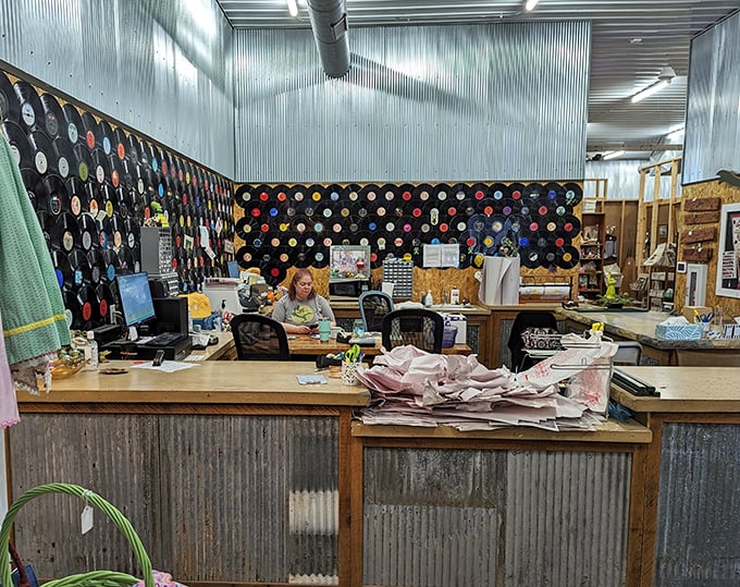 Behind every great antique mall is a passionate curator. This command center, complete with vinyl record decor, is where the magic happens.