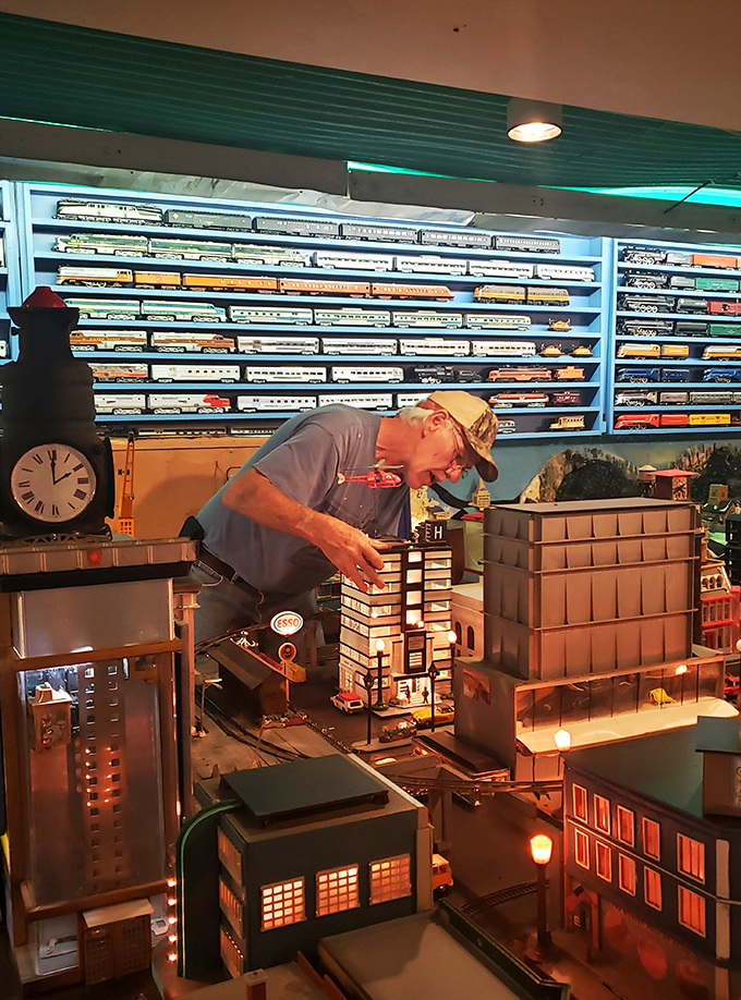 Meet the wizard behind the curtain! This dedicated craftsman is like a modern-day Geppetto, bringing miniature worlds to life with meticulous care.