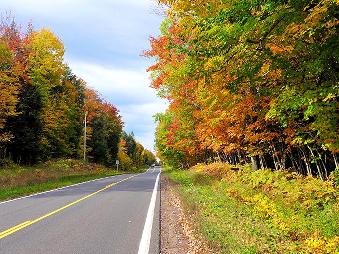 Autumn's color wheel gone wild! This road is like driving through a Crayola factory explosion, in the best way possible. Photo credit: SuperiorTrails
