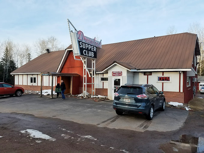 A slice of pure Northwoods charm, where stone pillars and warm wooden doors welcome you like an old friend's home.