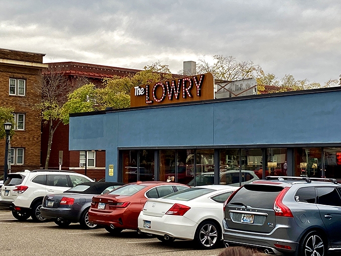 Neon dreams and cocktail schemes. The Lowry's sign glows like a beacon for night owls and bourbon aficionados. Photo credit: Brian Osweiler
