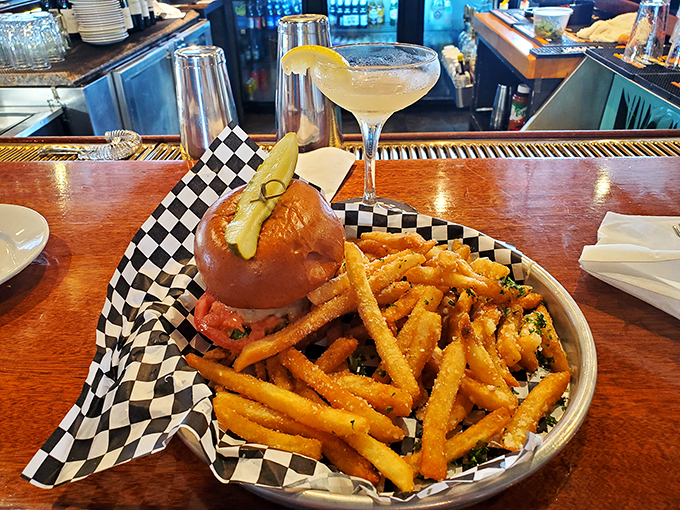 Who says seafood joints can't flip a mean burger? This juicy number, with a side of golden fries, might just turn a few lobsters.