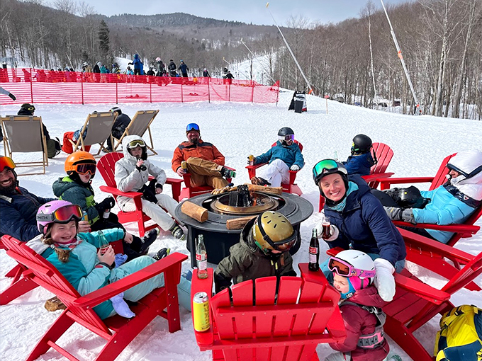 Ski boots by day, party boots by night. These happy campers are living their best apr&eacute;s-ski life around a toasty fire pit.