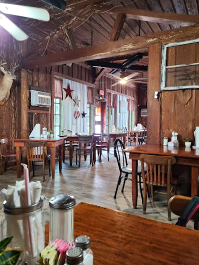 Wooden beams and ceiling fans spin tales of countless meals shared beneath this time-worn roof.