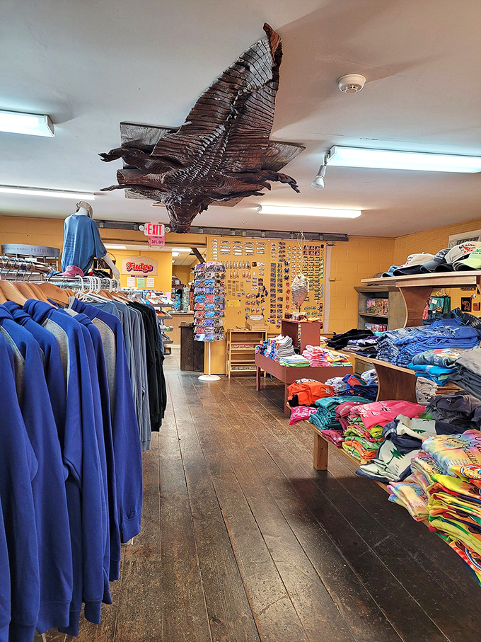 Under the watchful eye of a majestic wooden eagle, Maine-themed apparel lines the walls like a cozy local embrace.