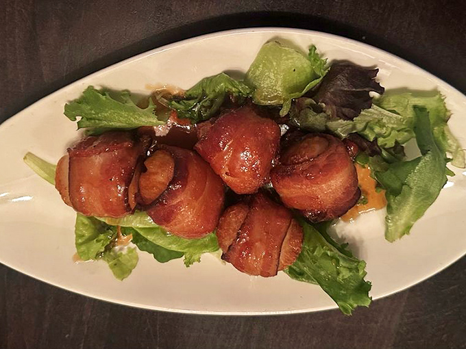These bacon-wrapped scallops lounging on fresh greens look like they just got back from a spa day.
