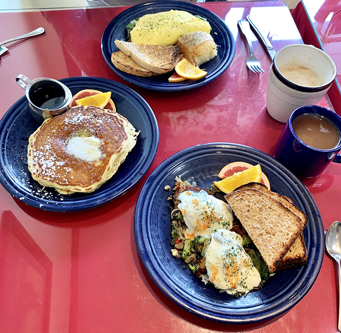 A breakfast spread that would make Ron Swanson weep with joy. Pancakes, eggs, and happiness, all on one table.