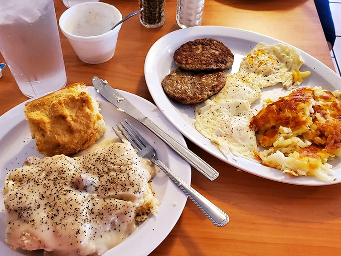 Country gravy blankets fresh biscuits while golden hash browns stand ready to make your morning absolutely perfect.