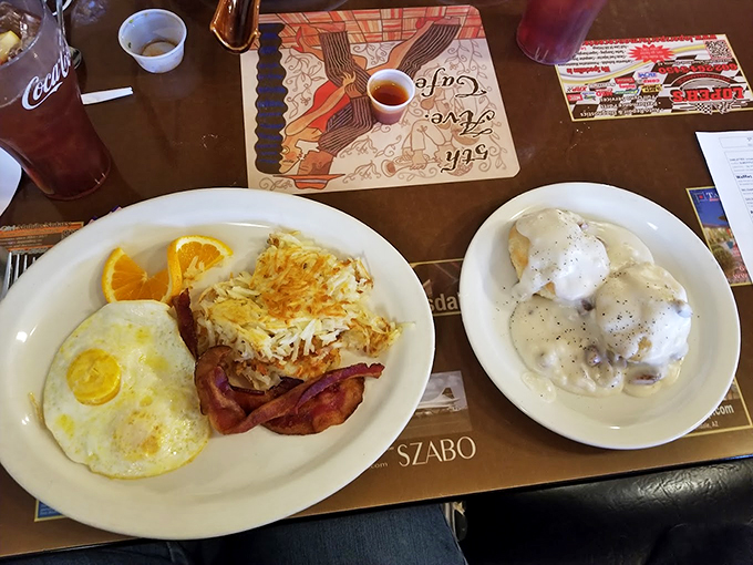 Biscuits and gravy share the spotlight with sunny-side-up eggs in this classic breakfast performance that never gets old. Photo credit: Donna Christensen (HB)