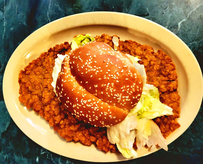 Holy cow! This burger's bigger than my first apartment and probably tastes a whole lot better.