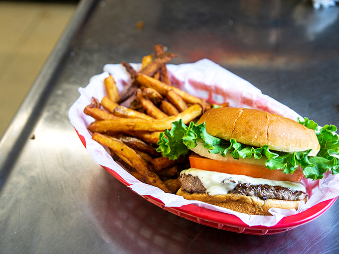 Fresh lettuce, ripe tomato, and a perfectly grilled patty - this burger's ready for its close-up, Mr. DeMille.