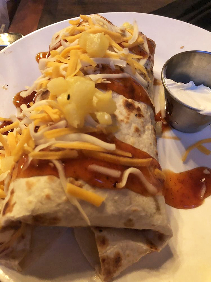 This isn't just a burrito - it's a flavor-packed cylinder of joy, dressed up in melted cheese and ready for its close-up.