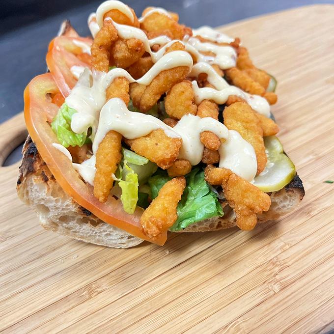Holy clam-oly! This Cajun clam strip po-boy is like a seaside vacation wrapped in bread, with a kick of Southern spice. Photo credit: Big Fatty's BBQ - Hartford