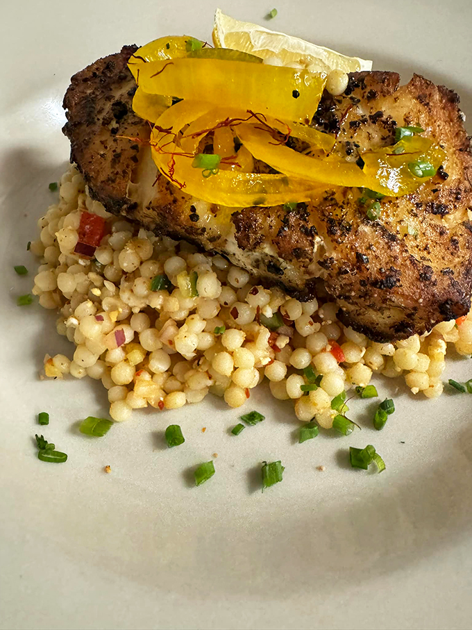 Sea bass so good, it'll make you bass-ically forget about all other fish. Paired with fragrant rice and a mystery sauce, it's an ocean of flavor. Photo credit: Casey's Caboose