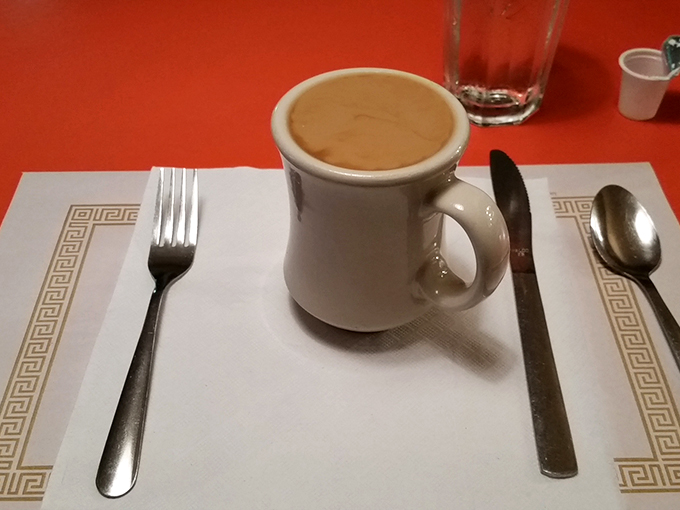 The elixir of life, served in a mug that's seen more mornings than most alarm clocks. Drink up, buttercup!