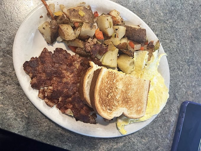 Corned beef hash that's crispier than your New Year's resolutions. Paired with eggs and toast, it's the breakfast of champions (and those who championed sleep over the gym). Photo credit: Jessica D.