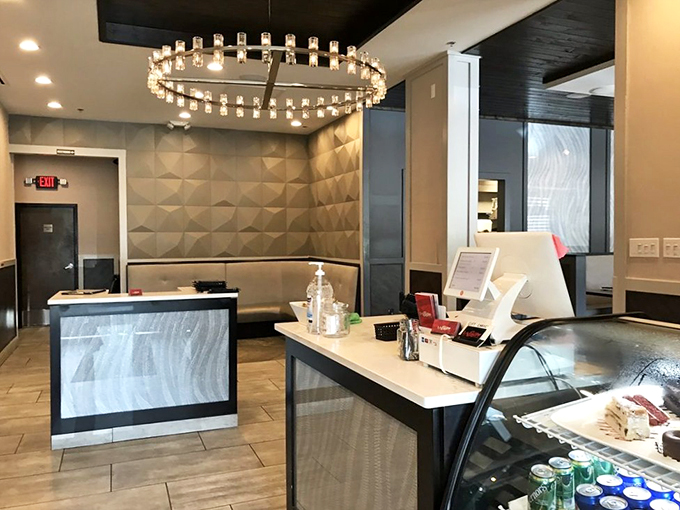 Modern elegance meets warm hospitality at this sleek counter, where a crystal chandelier adds just the right touch of sparkle.