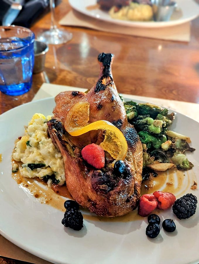 A duck dish that's ready for its close-up, complete with seasonal berries and a sauce that belongs in the Louvre.