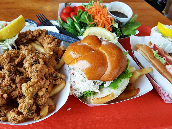 A feast fit for Neptune himself - fried clams, fresh rolls, and sides that make choosing just one impossible.