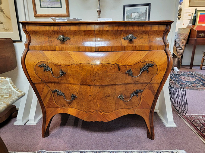 This curved bomb&eacute; chest could tell tales of elegant parlors past, its wood grain swirling like frozen caramel.