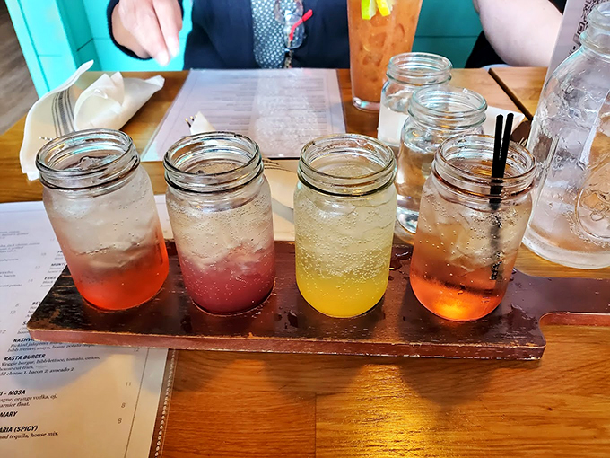 A rainbow of refreshing drinks in mason jars &ndash; because sometimes paradise comes with a straw and good company. Photo credit: Lisa Moreau
