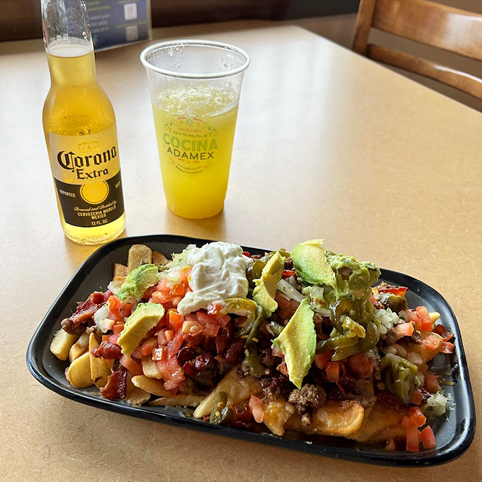 These loaded nachos aren't just a snack - they're an architectural masterpiece of flavors, perfectly paired with an ice-cold Corona.