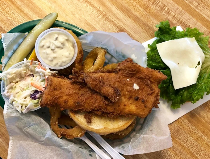 This haddock sandwich isn't just lunch - it's a masterpiece of crispy, flaky perfection on a toasted bun.