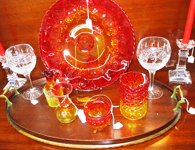 Amber and ruby glass catches the light like sunset through grandmother's window, each piece telling its own story.