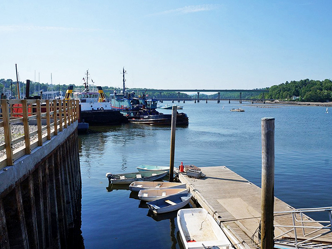 Working waterfront meets pleasure craft at Belfast Harbor, where fishing boats and sailboats share stories on the dancing waves. Photo credit: @AndyANew