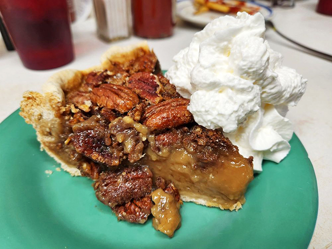 This isn't just pecan pie, it's a slice of the American dream &ndash; gooey, nutty, and topped with a cloud of whipped cream. Fork, meet mouth!