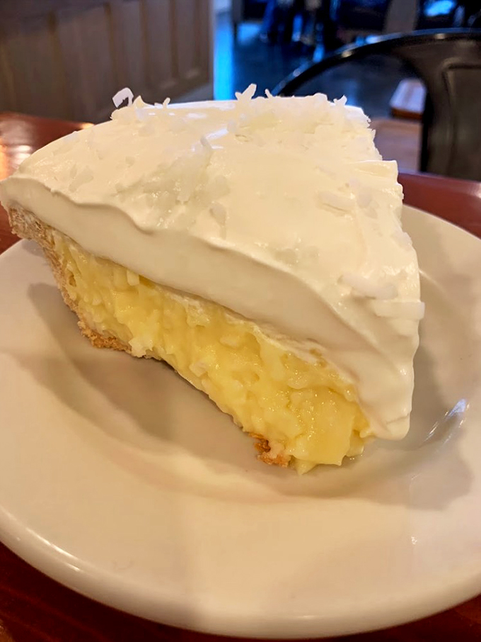 A mountain of whipped cream crowns this key lime masterpiece, bringing tropical sunshine to Down East Maine.