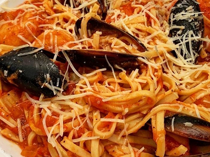 Fresh mussels nestled in perfectly twirled pasta, crowned with Parmesan&mdash;it's like the Mediterranean Sea sent its best regards.