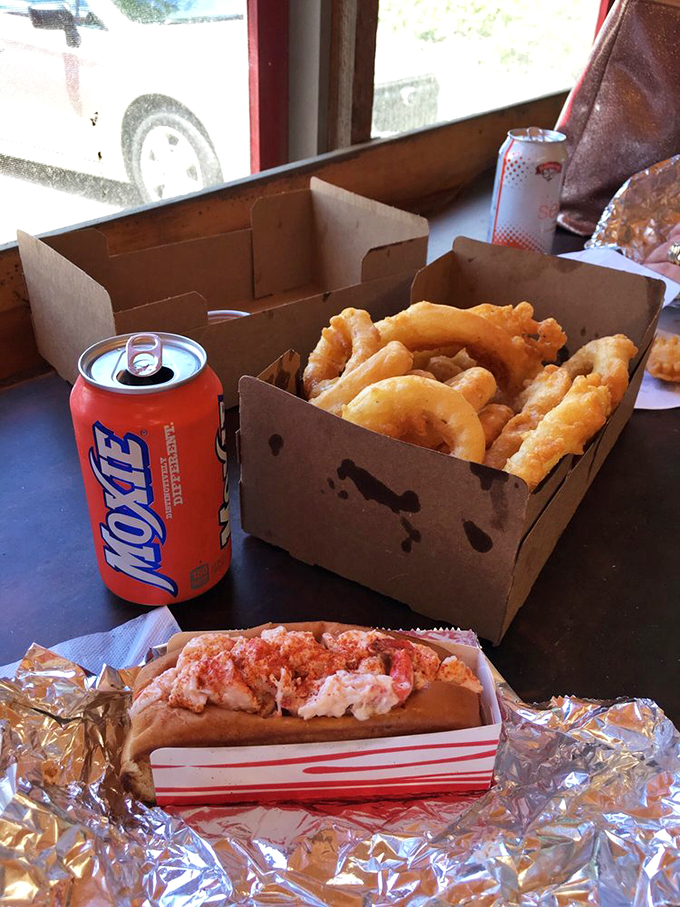 The classic Maine duo: a lobster roll and crispy onion rings, proving some relationships are simply meant to be. 