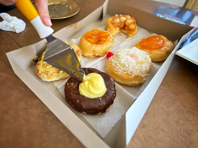 A box of pure joy&mdash;each donut telling its own delicious story through different glazes and toppings.